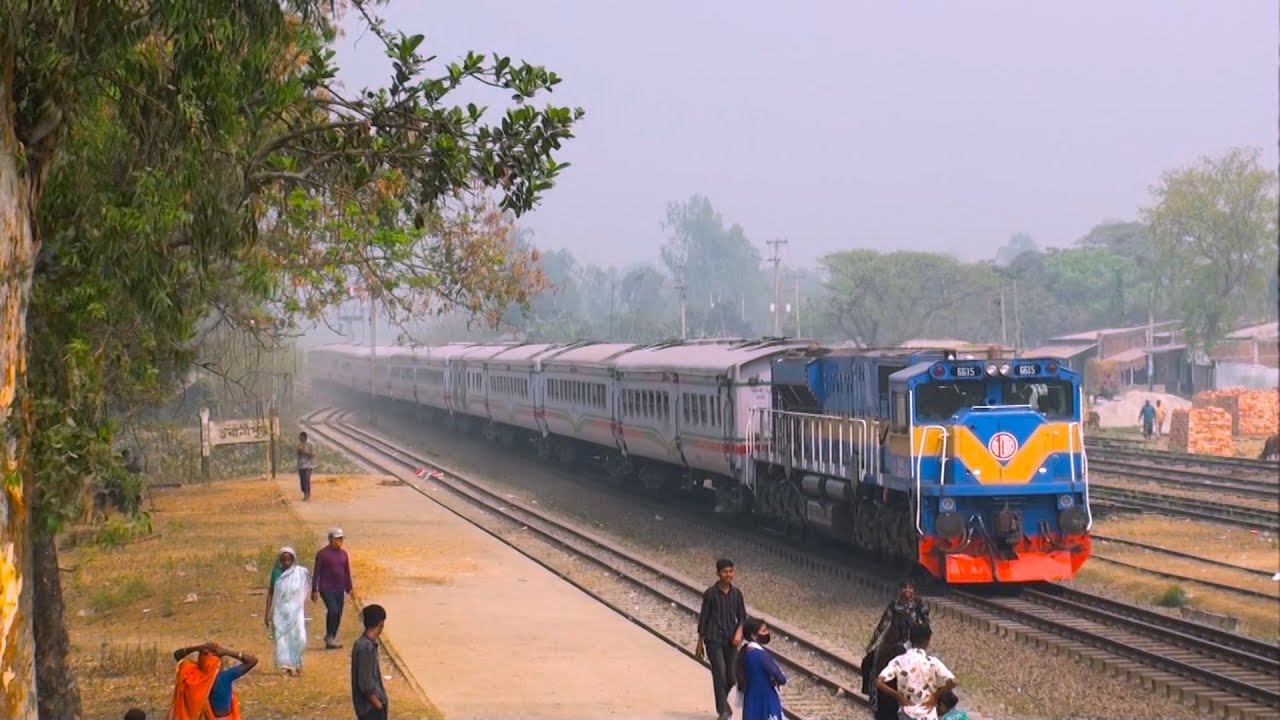 Rupsha Express is passing Bhabanipur station and railway gate raising a ...