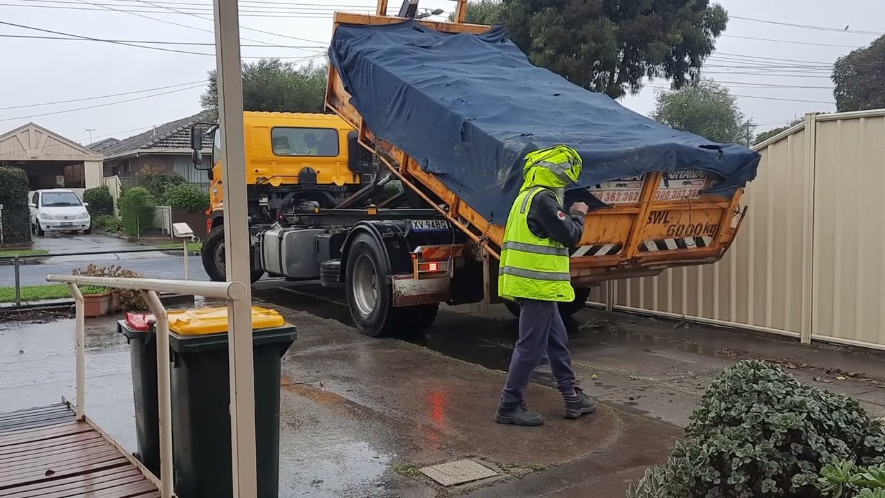 loading a skip bin - YouTube