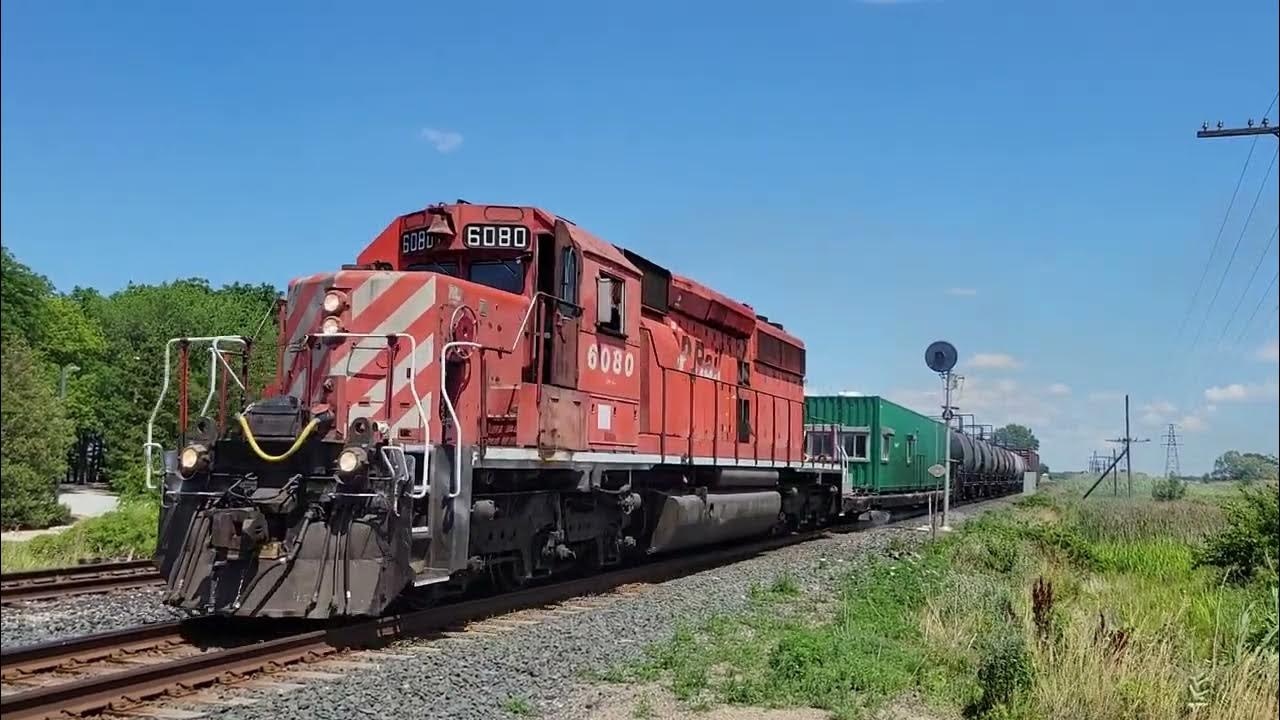 CP sd40-2 6080 throttles up with the weed spray train - YouTube