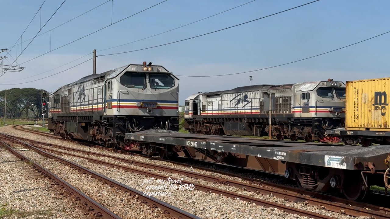 KTMB Class 26101 Tanjung Aru locomotive with flatbed wagons heading to ...