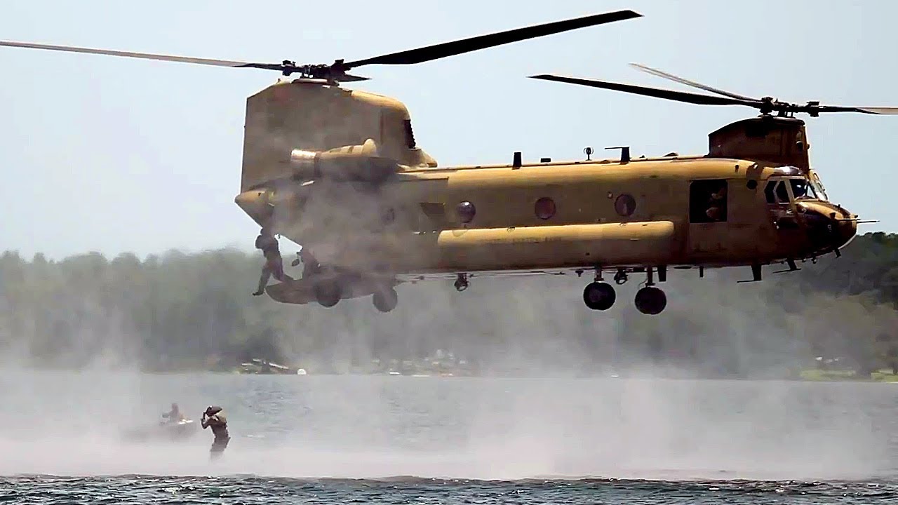 Soldiers Helocast from a CH-47 Chinook Helicopter During Training ...