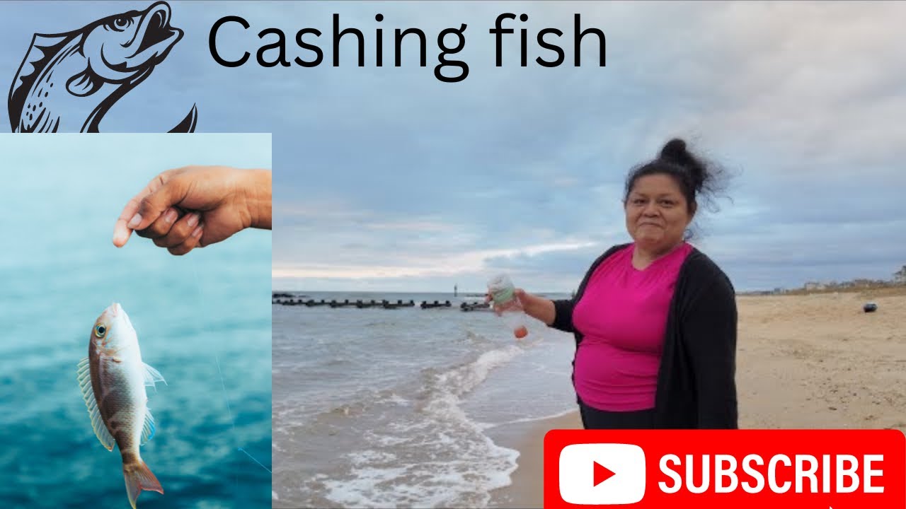 Spanish woman teaching African man how to cash fish from the sea and ...