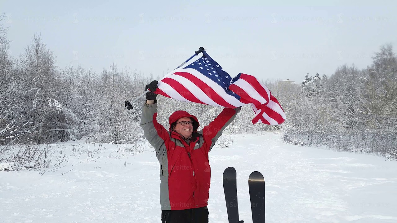 Middle-aged man sport fan waving an American flag - YouTube