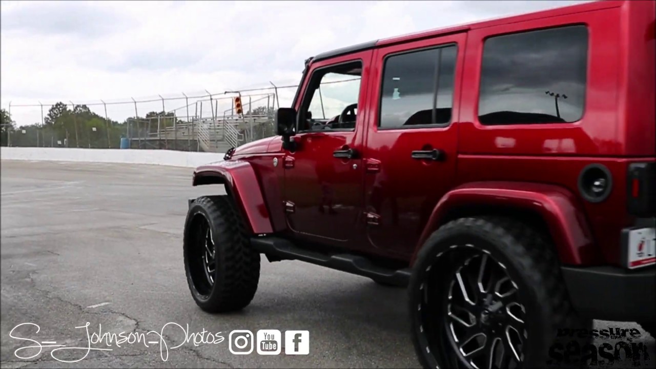 Jeep Wrangler on big Fuel offroad wheels, mud tires, candy paint, and ...
