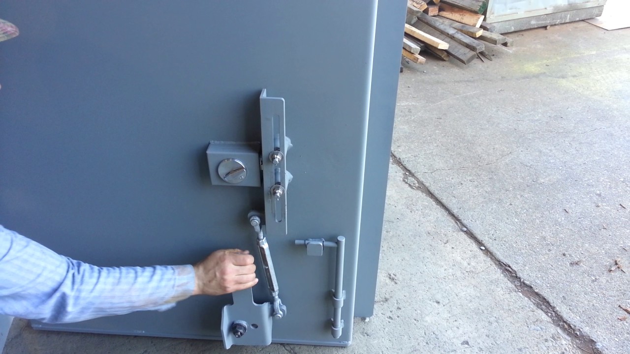 Cam latch and inset deadbolt assembly on a double leaf blast door - YouTube