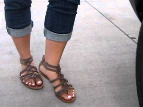 Female Feet and Toes of 20 something Latina in brown Gladiator sandals