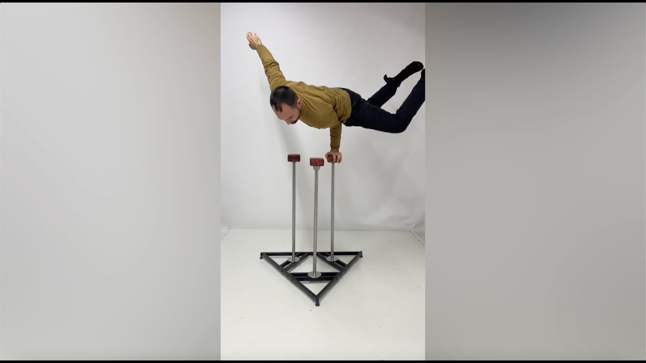 Handstand canes on collapsible triangular platform / Циркові тростини ...