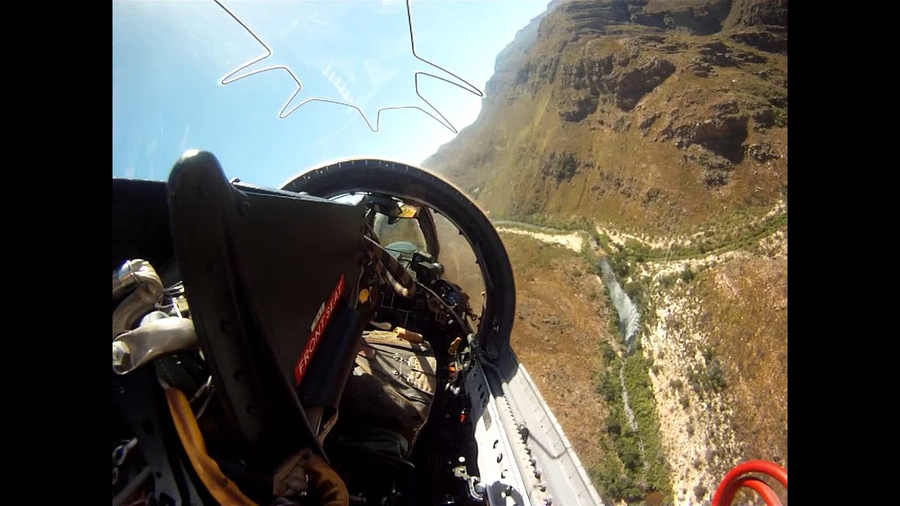 Buccaneer flying through the mountain valleys just a few feet from ...