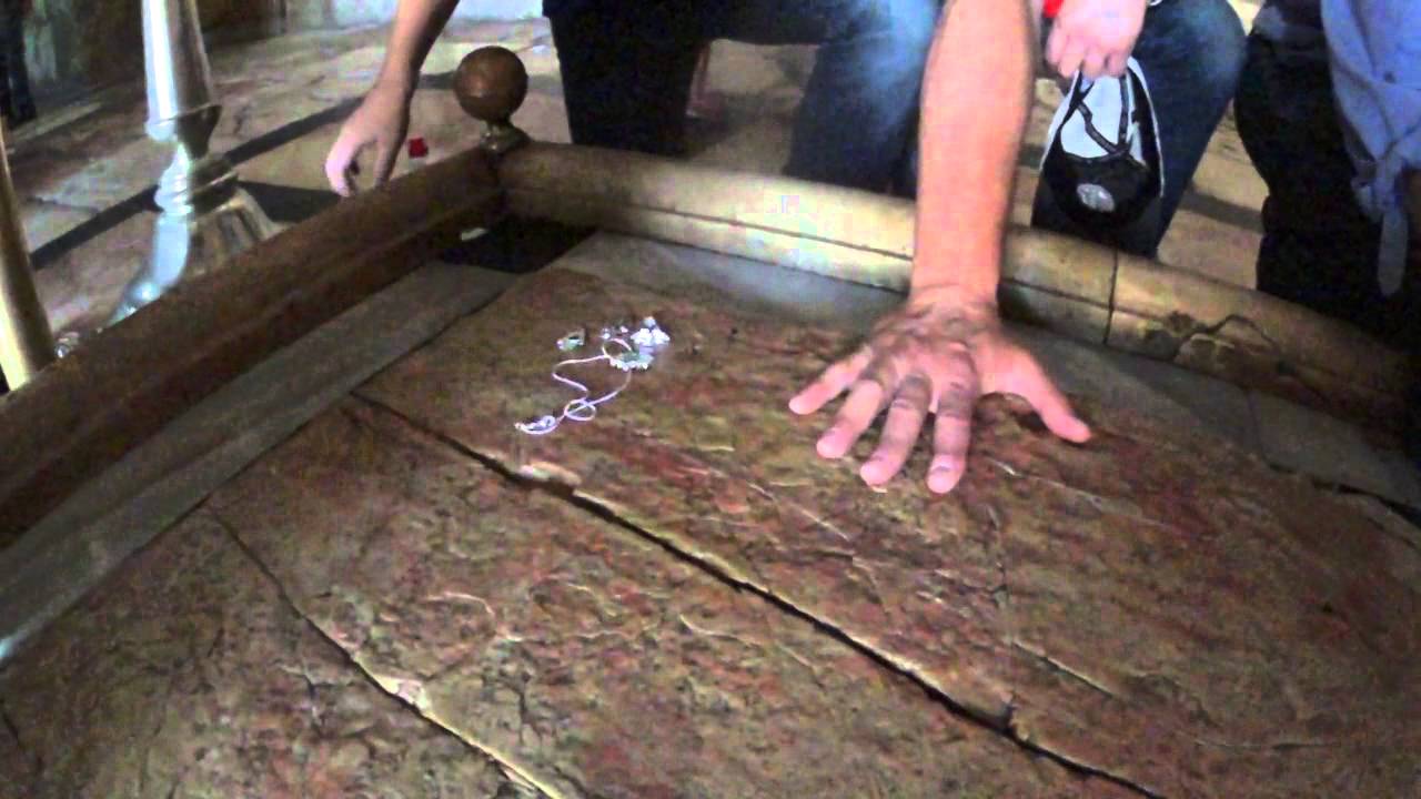Blessing the souvenirs on the Stone of Unction, Church of the Holy ...