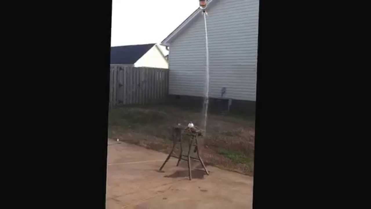 Water bottle rocket with air compressor fittings first attempt almost ...