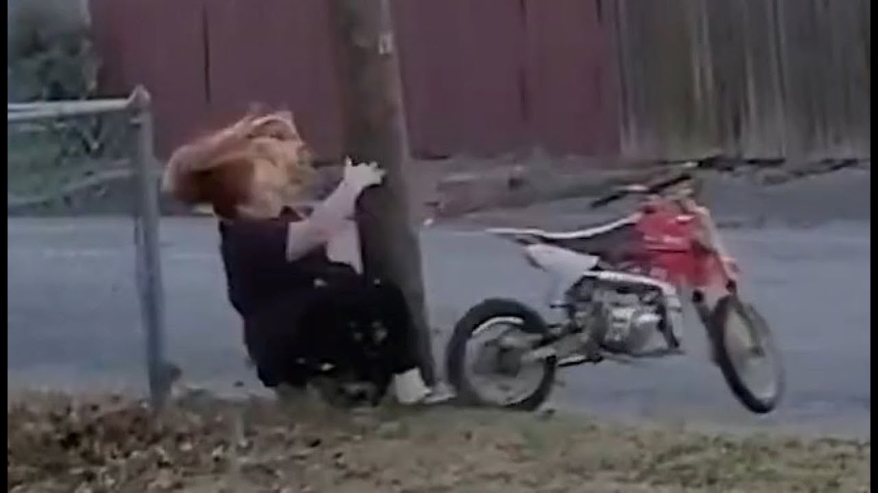 woman on a motorcycle hits a pole - YouTube