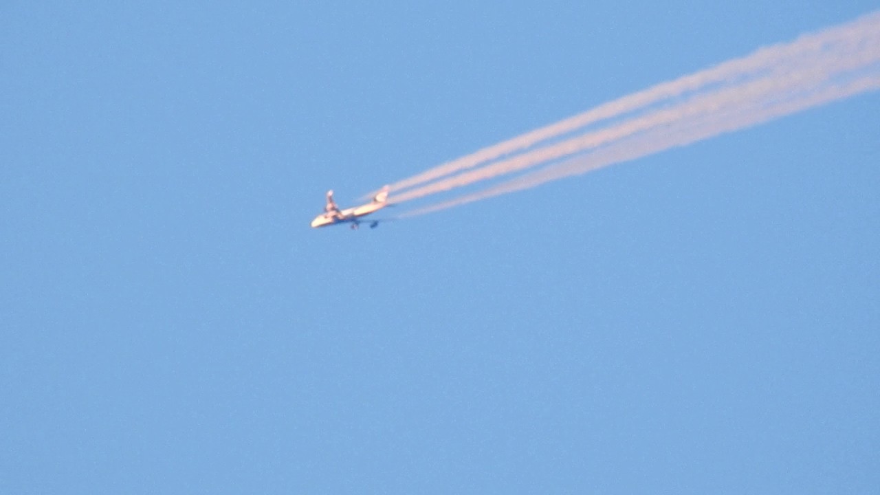 Zoomed in on a jet plane with Nikon p900 - YouTube