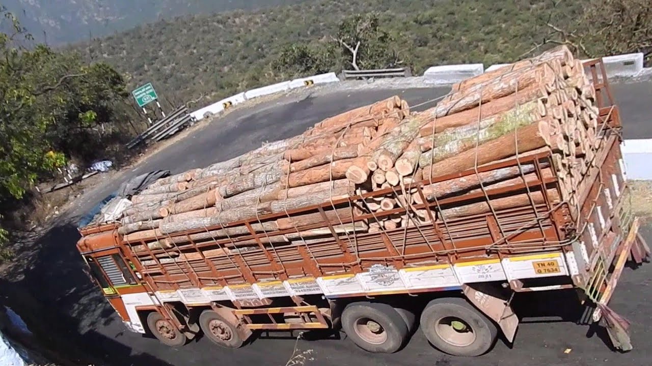 Heavy Load timber lorry and other heavy lorries risky bend turn. - YouTube