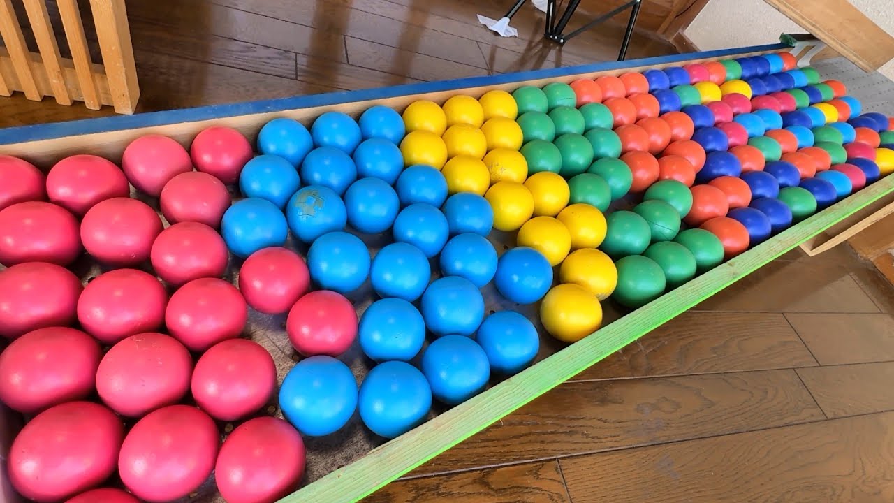 Make a marble run course using three rotating buckets and a colorful ...