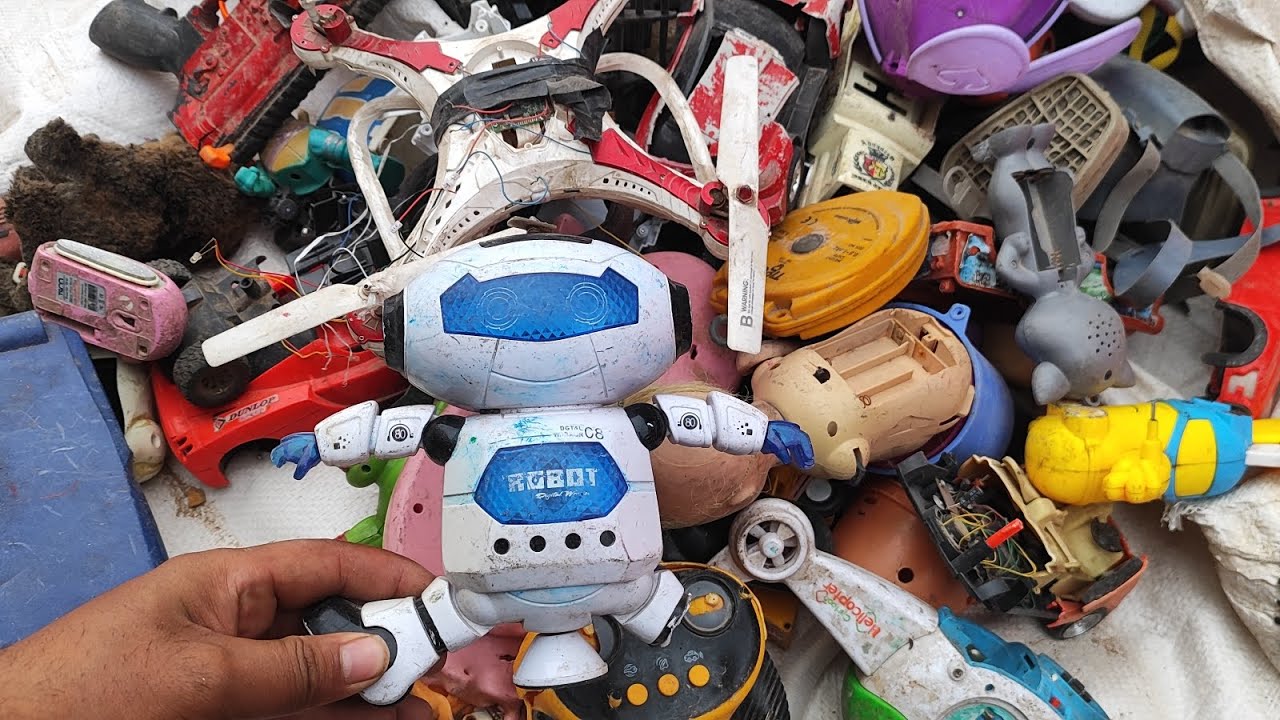 Breaking several toys by banging them and testing them. - YouTube