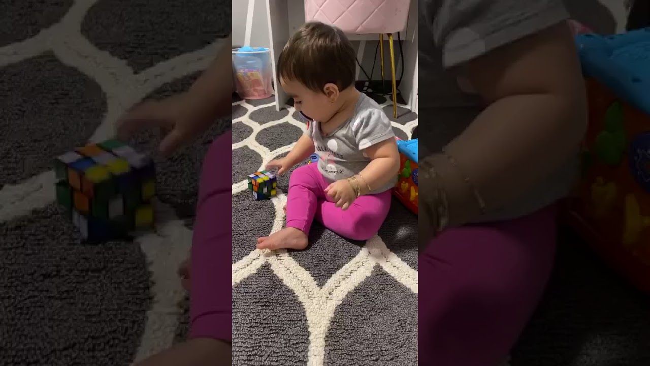 10 month old baby trying to solve a Rubik’s cube - YouTube