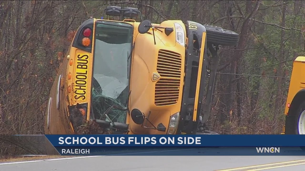 Wake Co. school bus flips going around curve in Raleigh - YouTube