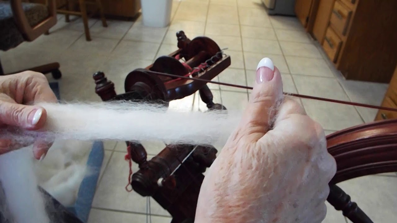 Preparing wool roving for spinning - YouTube