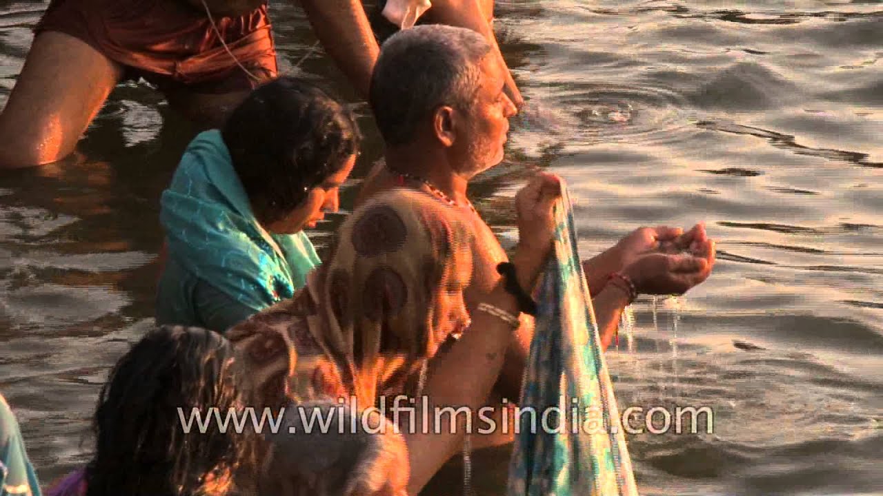 Hindu devotees taking a holy dip during Maha Shivratri at Varanasi Ghat ...