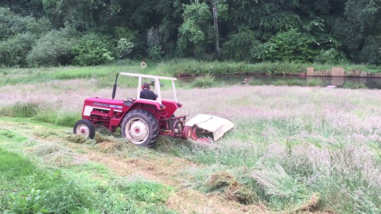 Mowing & Tedding First Hay 2019 - YouTube