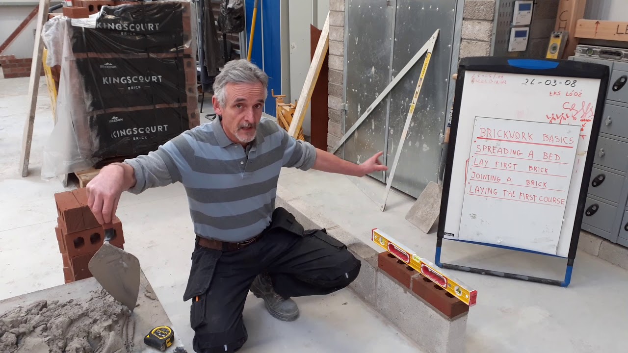 Laying the first course of bricks - YouTube