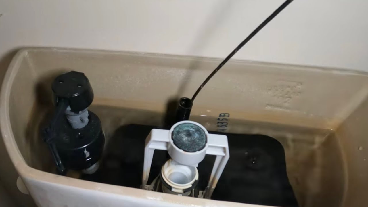 I stuck a metal rod in the back of this toilet to clear it and this is ...