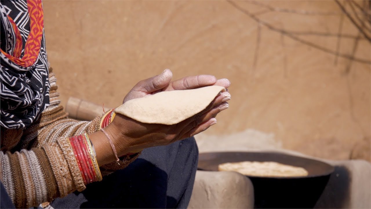 A women making chapati in a rural Indian kitchen | Indian Stock Footage ...