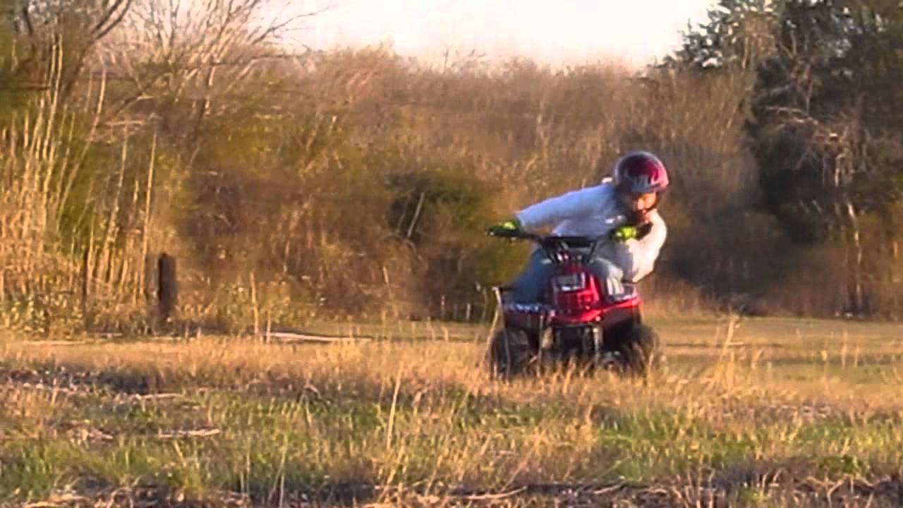 Coolster 110 cc 4x2 mini 4 wheeler ---- 10 year old David riding in ...