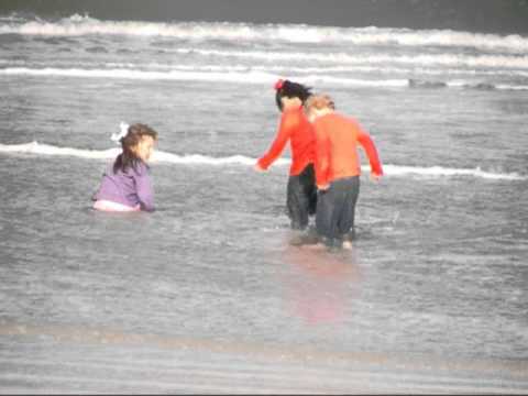 Kids playing on the cold beach - YouTube