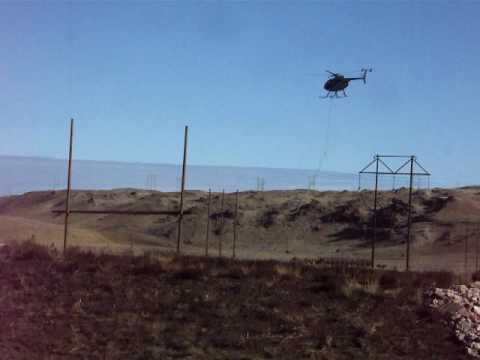 Helicopter stringing cable on Hughes Transmission Project - YouTube