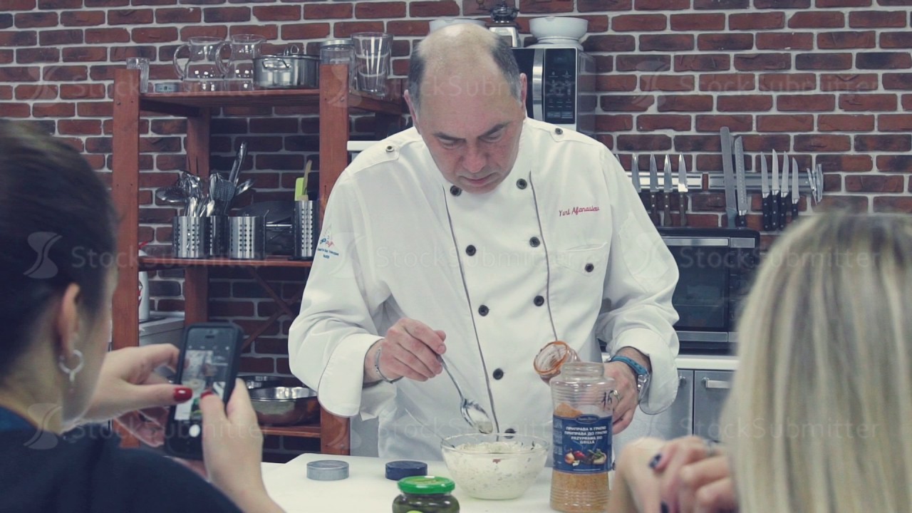 Russia Novosibirsk 2016. The chef in the kitchen. Chef cook teaches a ...