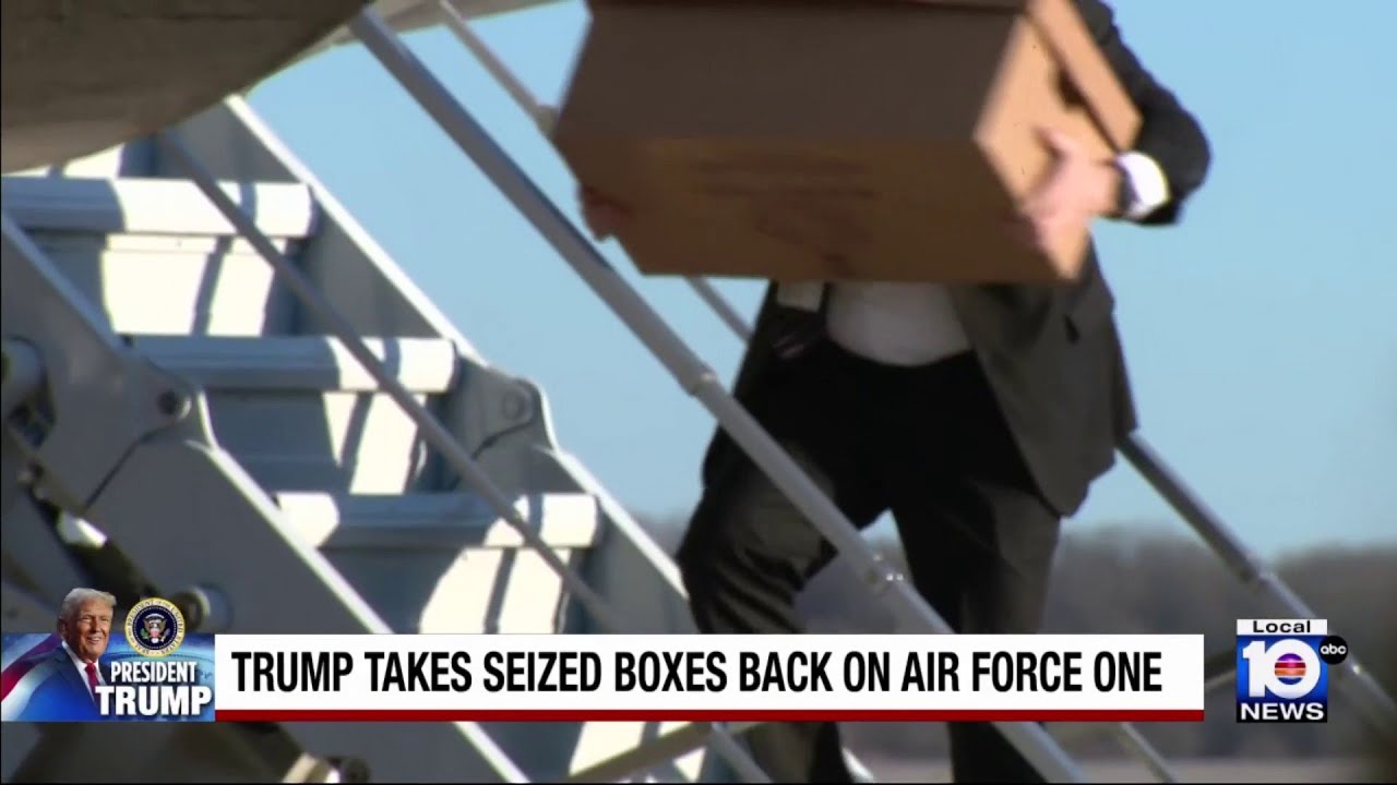 Trump takes seized boxes back on Air Force One - YouTube