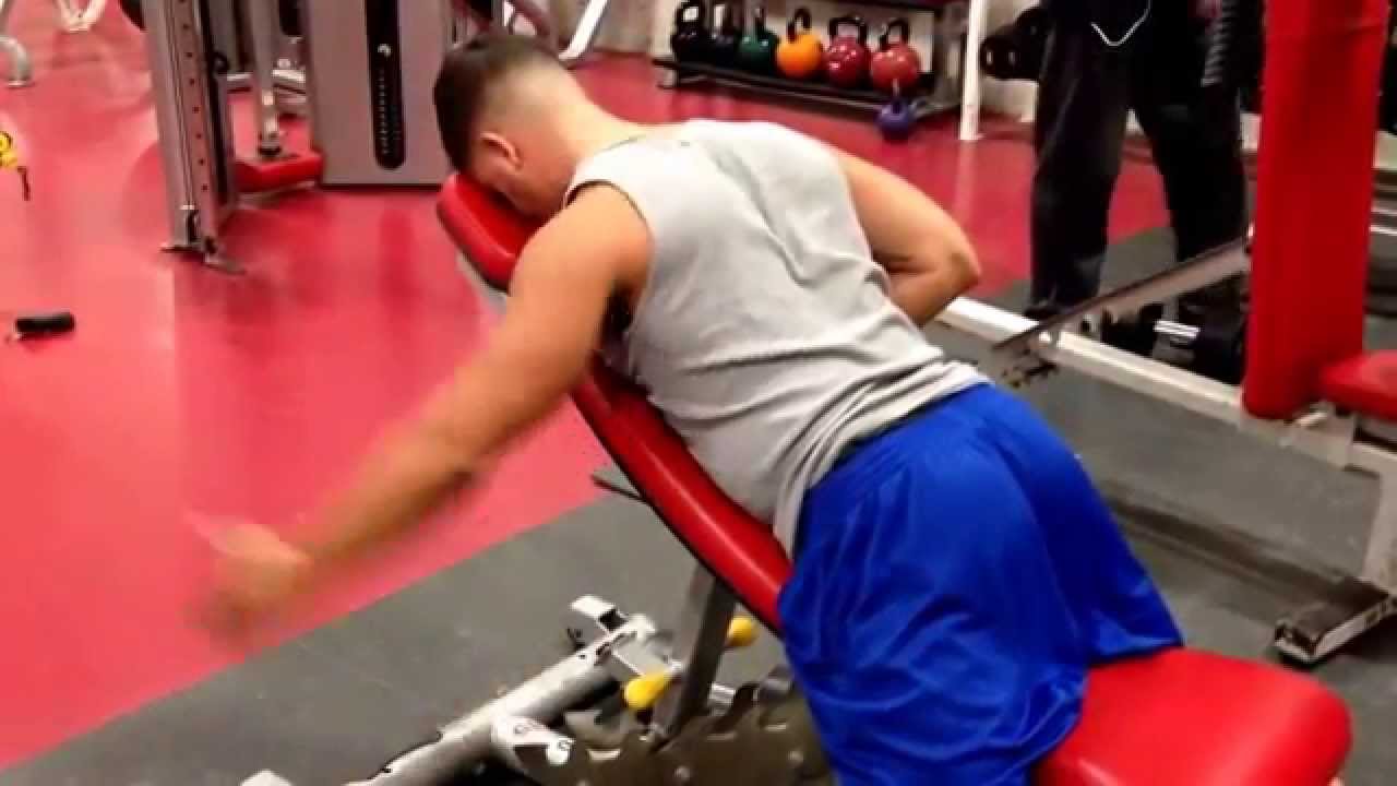Incline bench prone one arm trap raise - YouTube