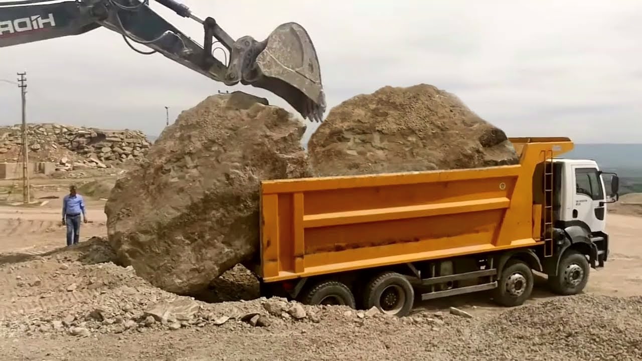 Loading Large Rocks Into a Truck That is Oversized - YouTube