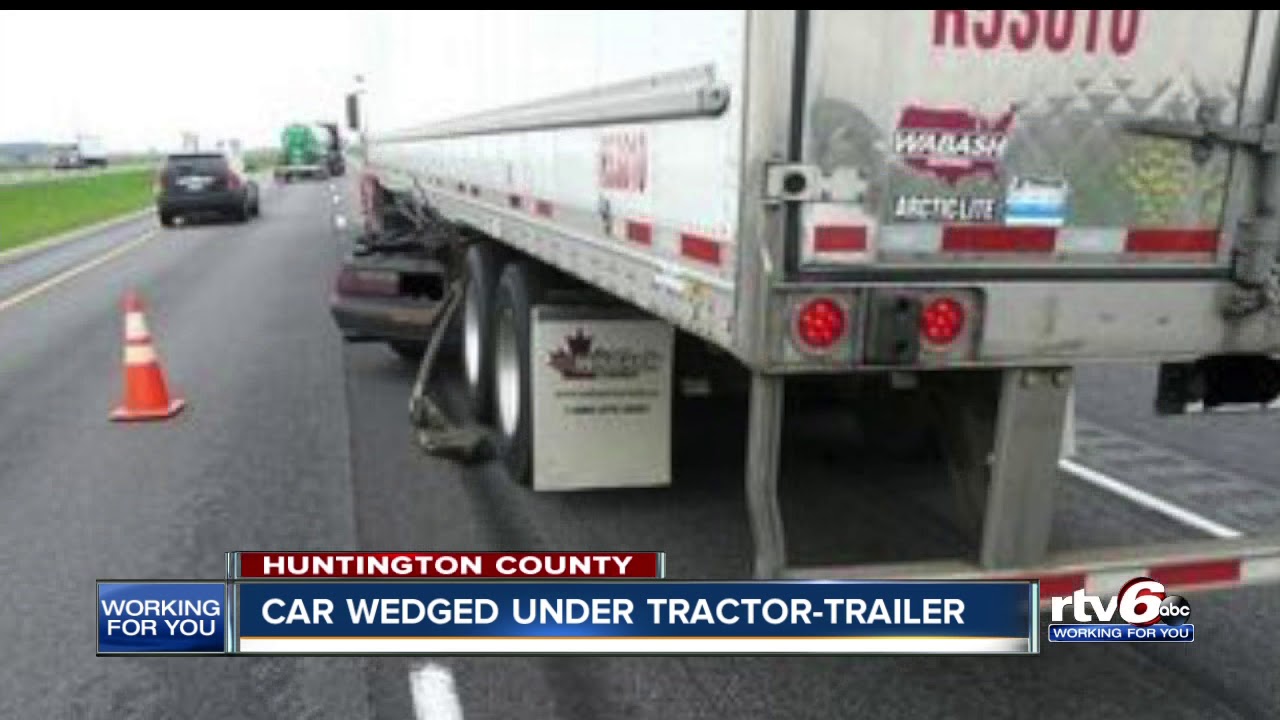 Man drives under moving semi-truck on I-69 - YouTube