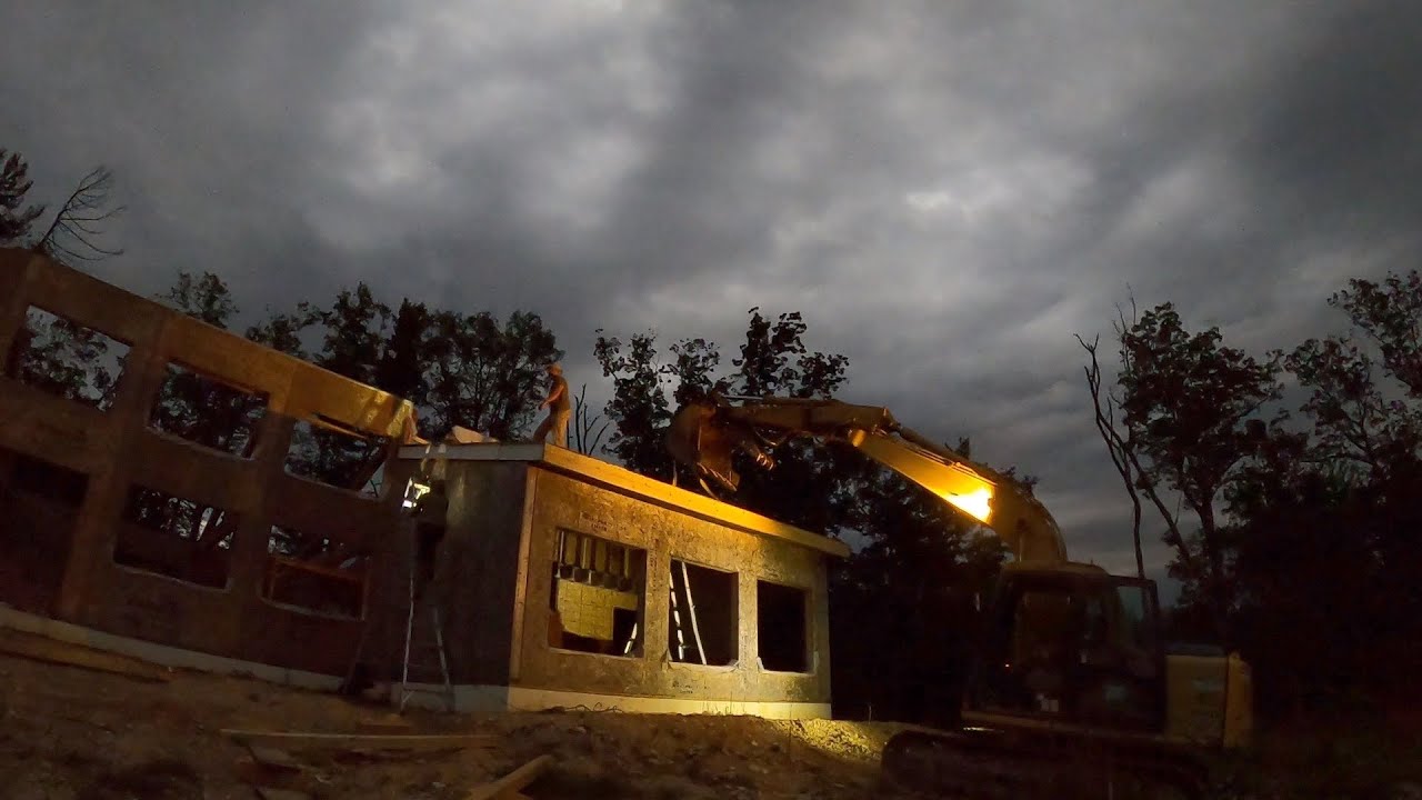 Roof Riders in the Sky. Raising a roof panel after work. DIY Post and ...