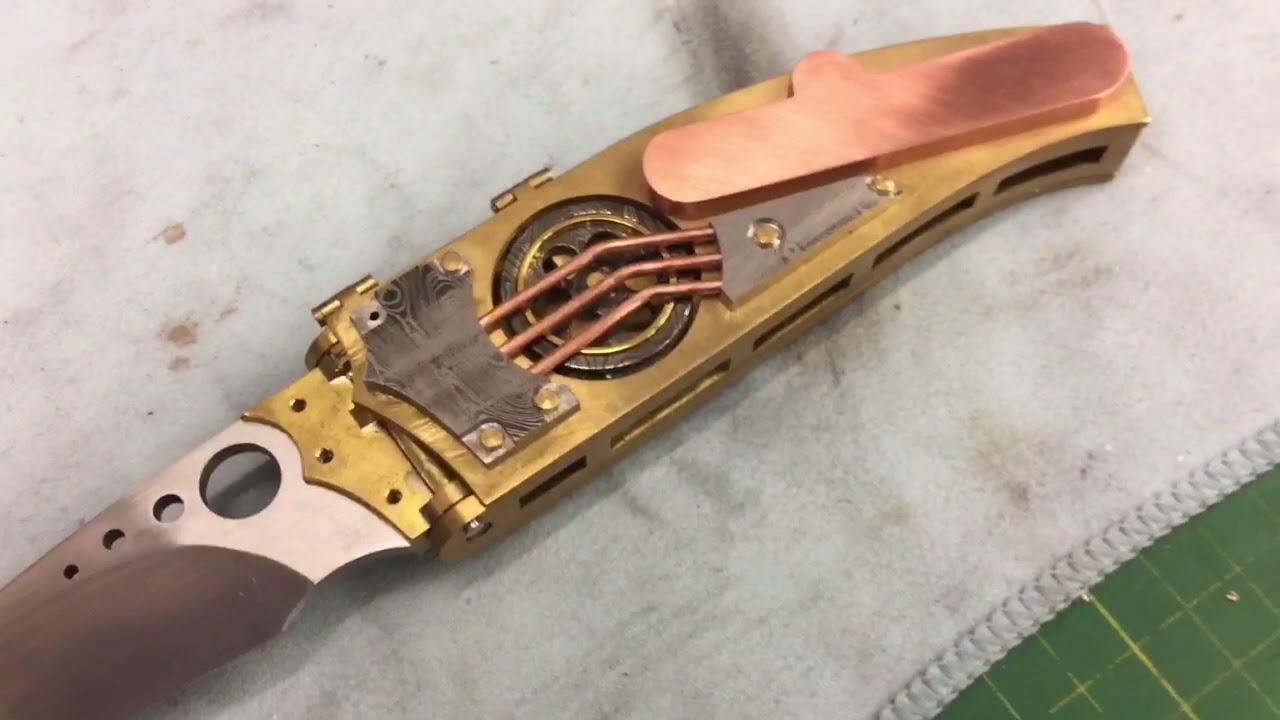 Steampunk knife with the copper case over the piston - YouTube