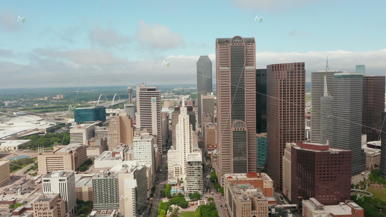 Panning aerial view of cityscape. Drone flying around tall modern ...
