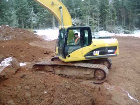 excavator digging in frost - YouTube