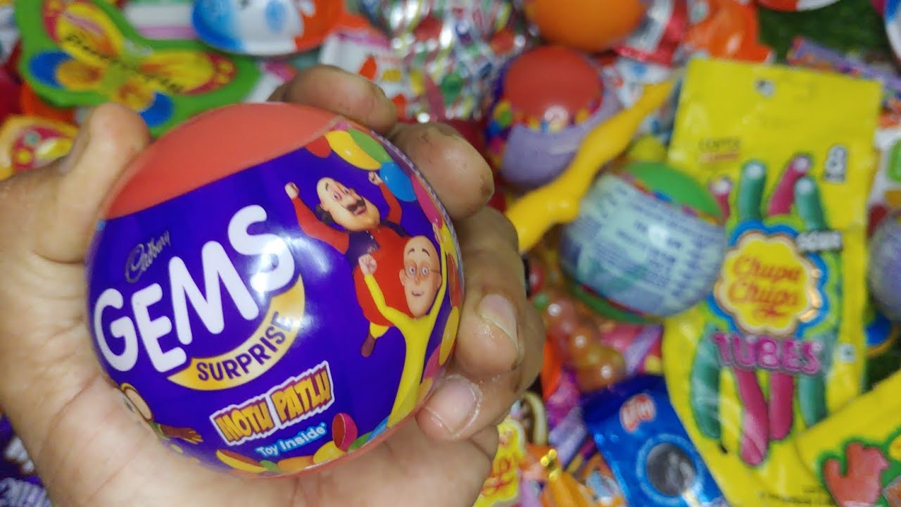 some lot's of colorful candies and yummy new edition Cadbury gems ball ...