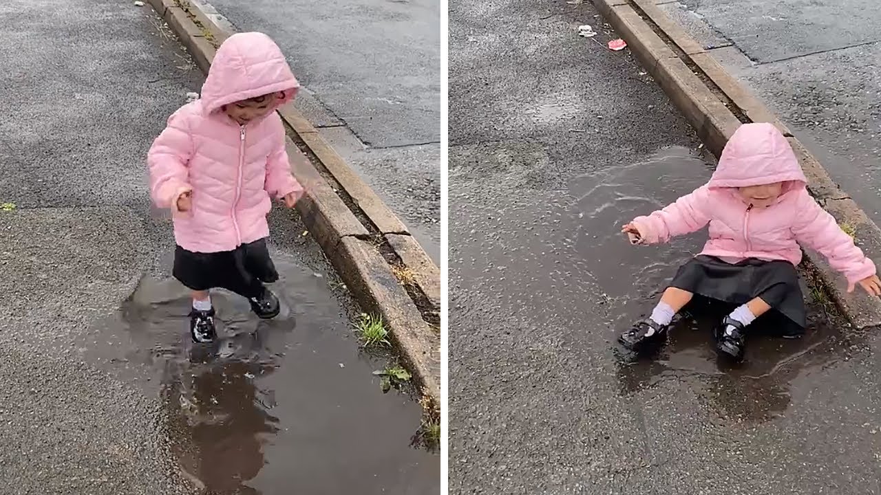 Little girl throws her entire body into rain puddle #shorts - YouTube