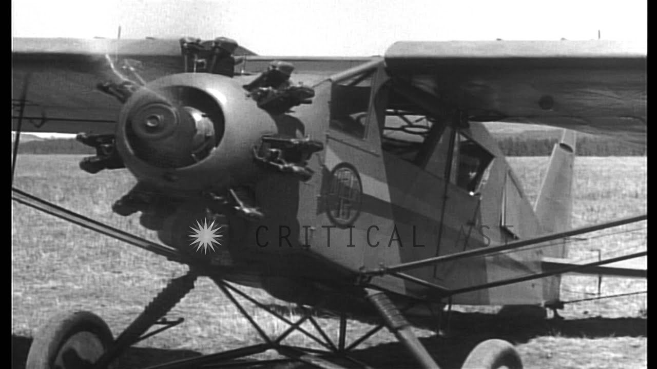 A pilot in cockpit of Potez 25 biplane in Ethiopia. Scenes of Breda Ba ...