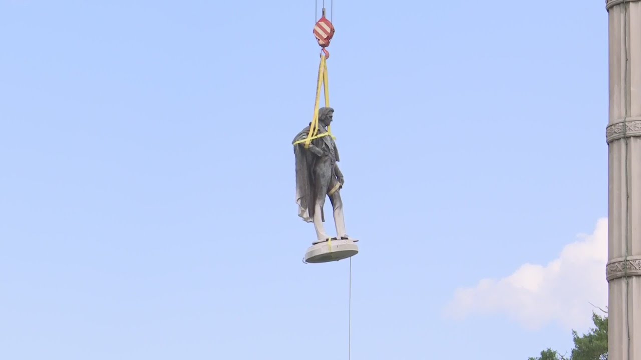 Crews remove the John C. Calhoun statue from its pedestal high above ...