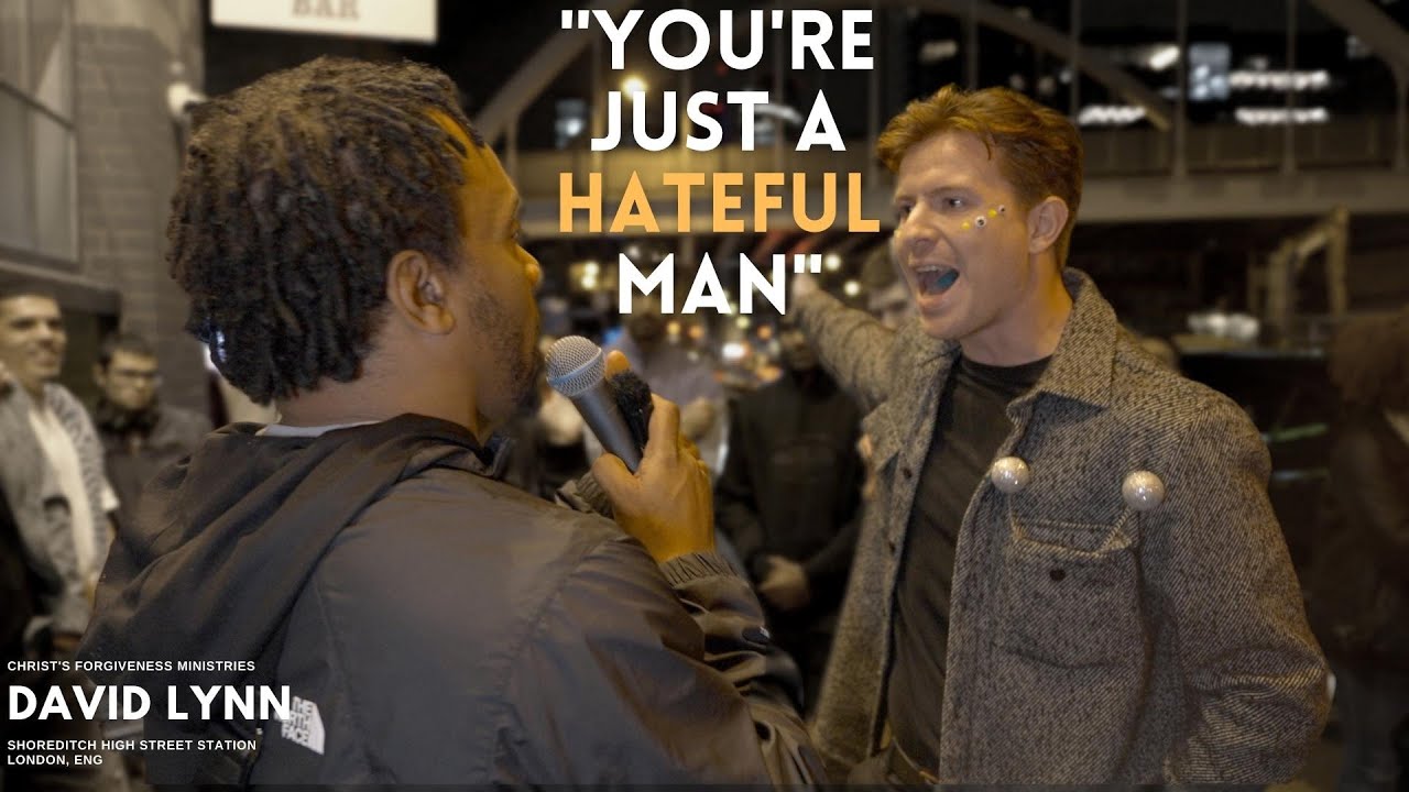 Protester calls Preacher a "HATEFUL MAN WITH A MICROPHONE “ - YouTube