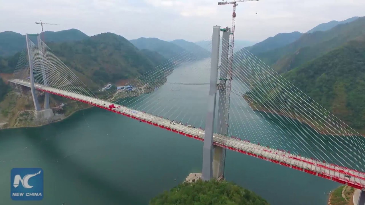 Main span of "super" bridge in SW China completed - YouTube
