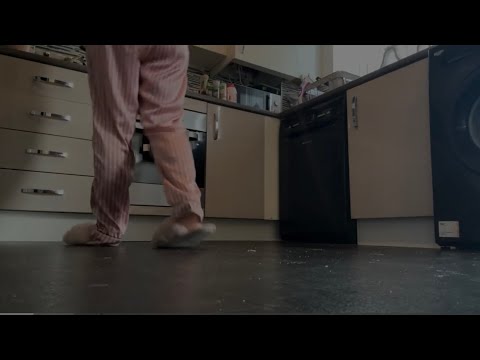 Making lunch wearing fluffy slippers and satin loungewear - walking on crumbs