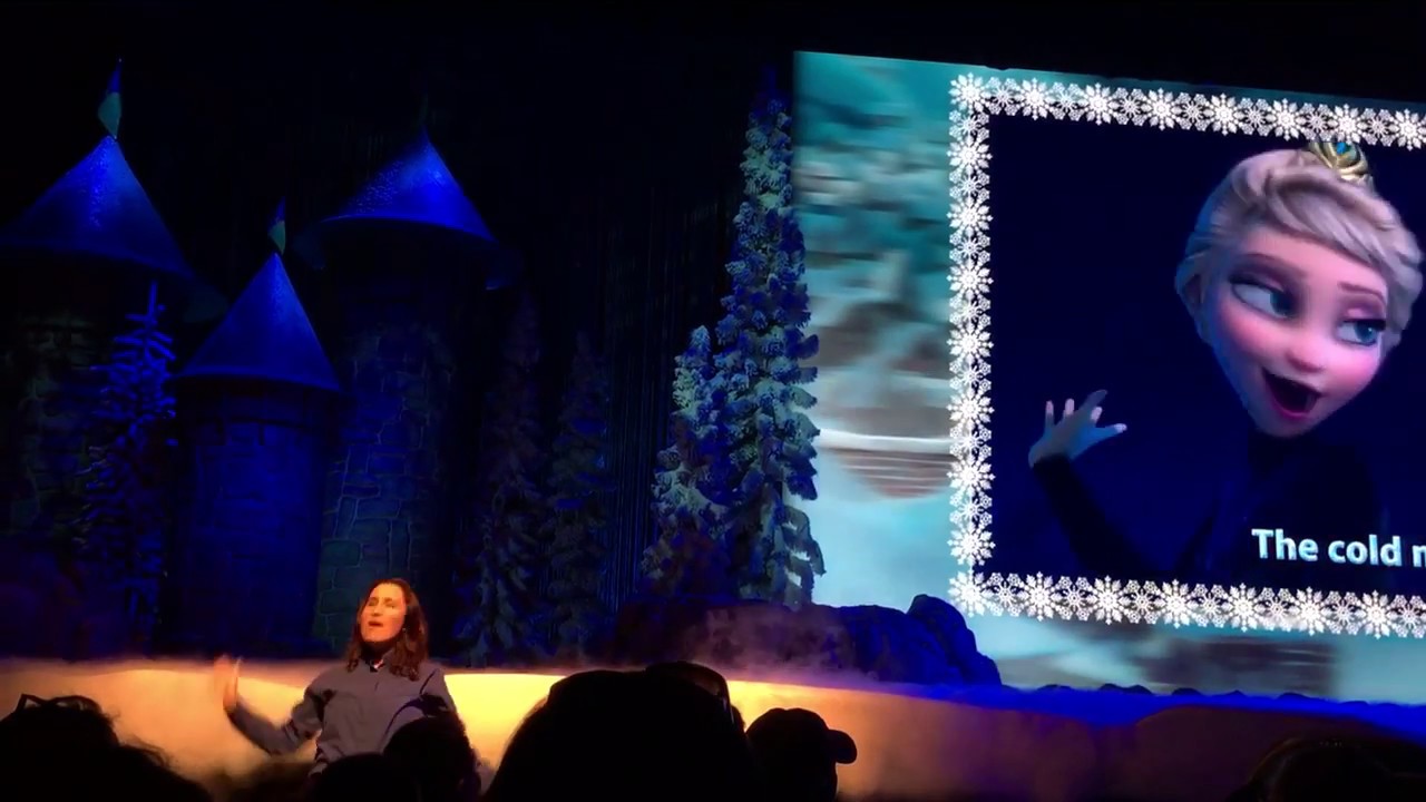 A sign language interpreter performs Let it Go in Disney World - YouTube