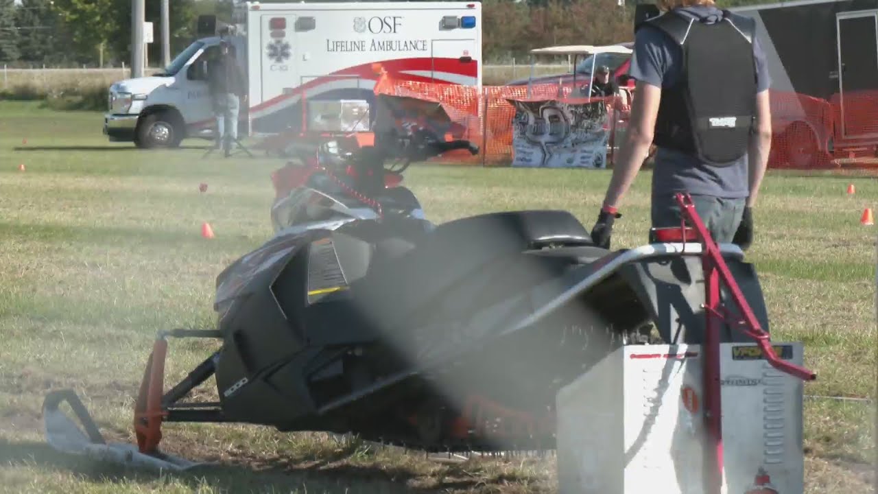 Belvidere holds snowmobile races...on grass - YouTube