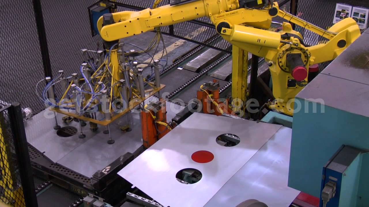 Robotic Arms Moving Sheet Metal Along Assembly Line - YouTube