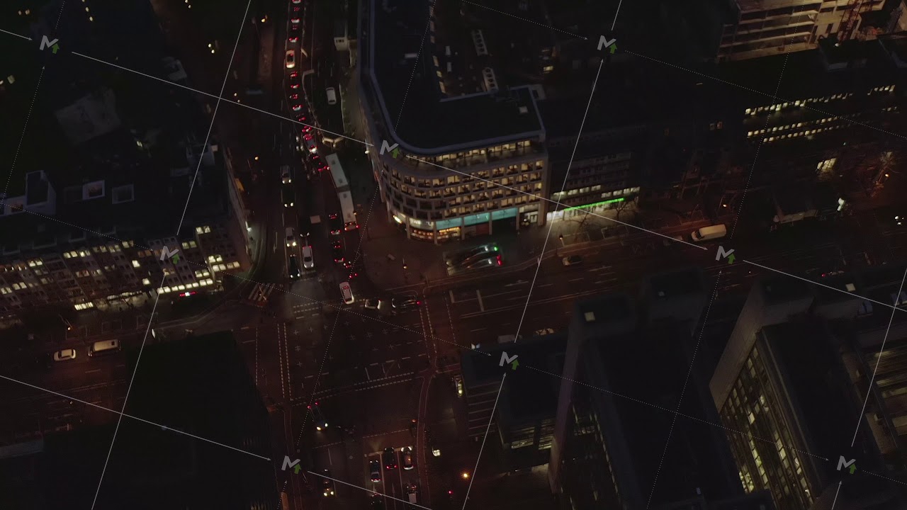 AERIAL: Beautiful Overhead Shot of busy intersection at night with Car ...